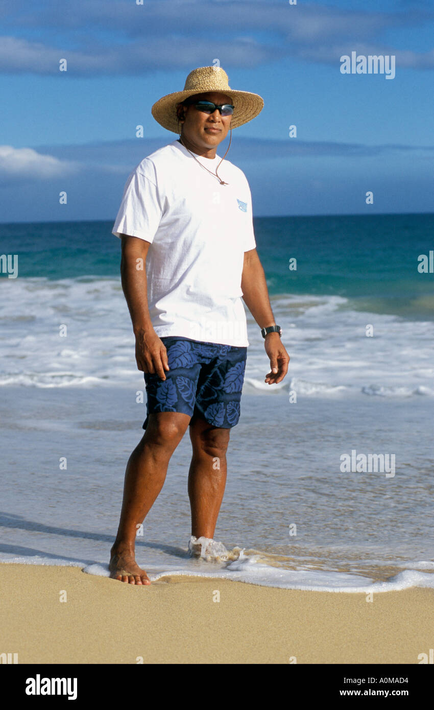 Hawaiian man on beach Stock Photo - Alamy