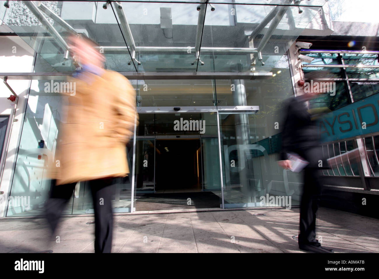 Office workers coming out of an office Blurred Walking Stock Photo - Alamy