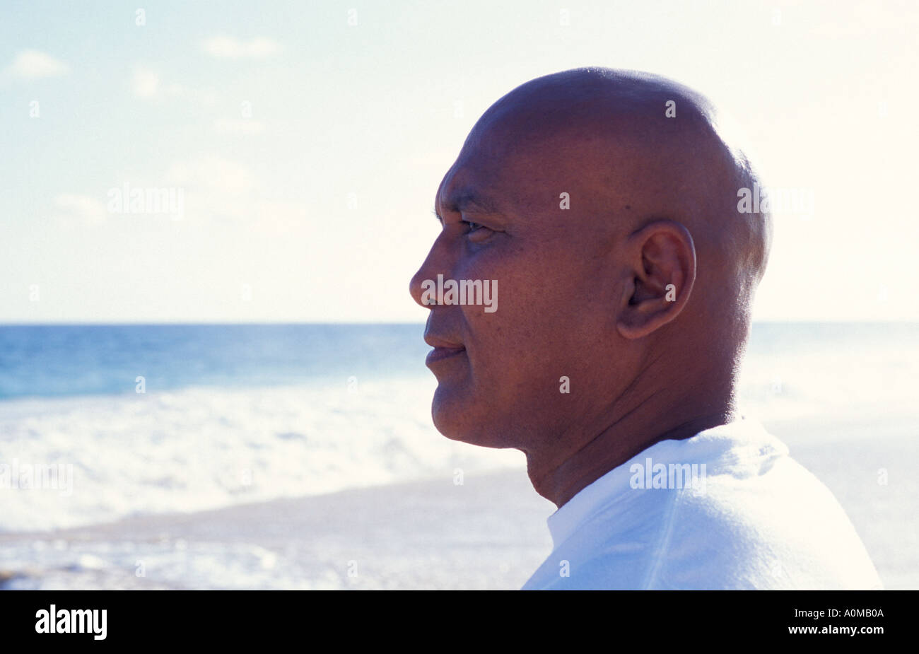 Hawaiian man on beach Stock Photo - Alamy