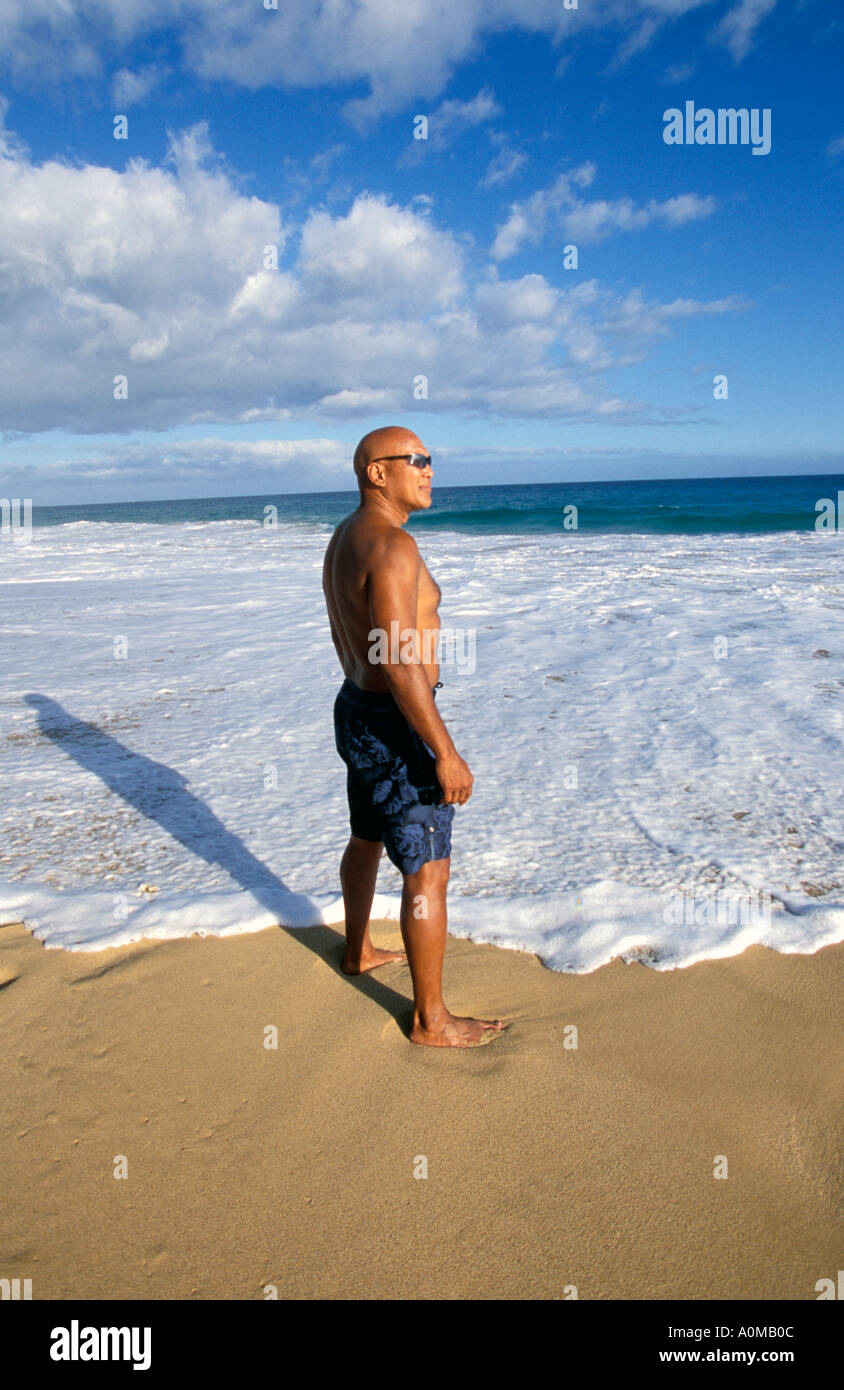 Hawaiian man on beach Stock Photo - Alamy