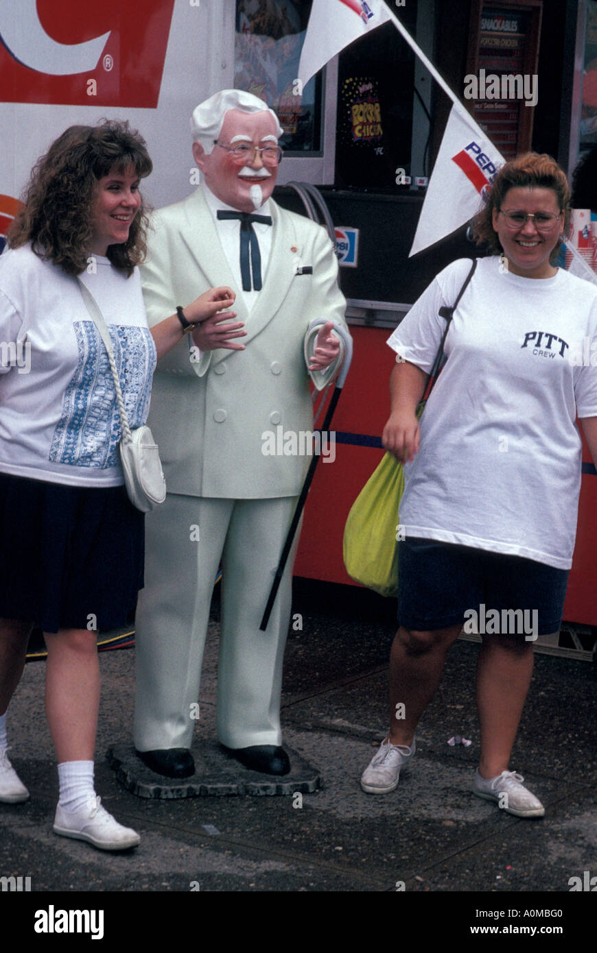 2 two ladies women w replica of Colonel Sanders founder of Kentucky ...