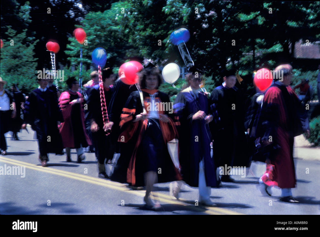 community day parade cap and gown movement motion blur ballons Stock ...