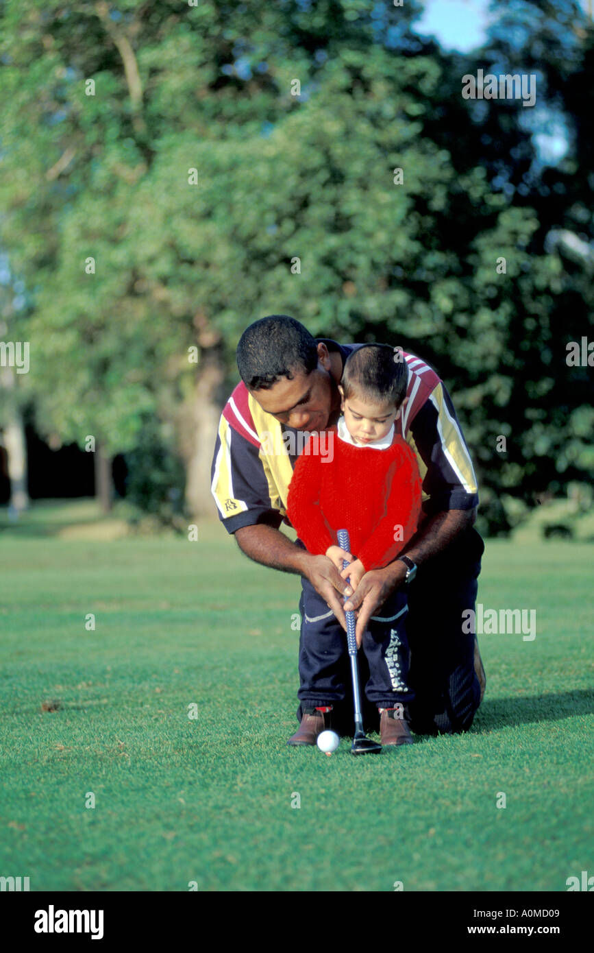 Australia Qld aboriginal father son on golf course father teaching son ...