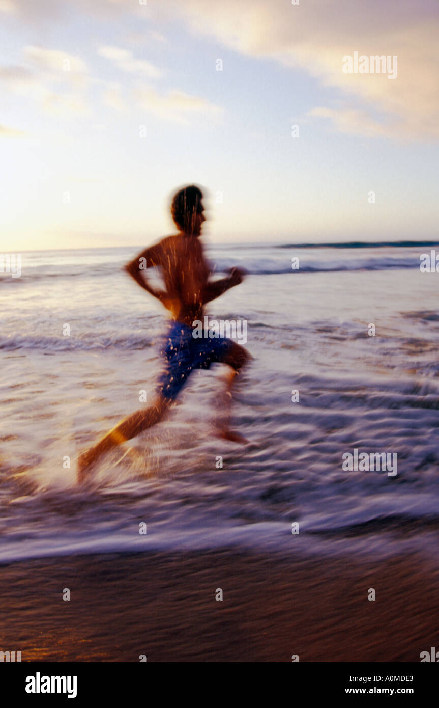 Man running into waves hi-res stock photography and images - Alamy