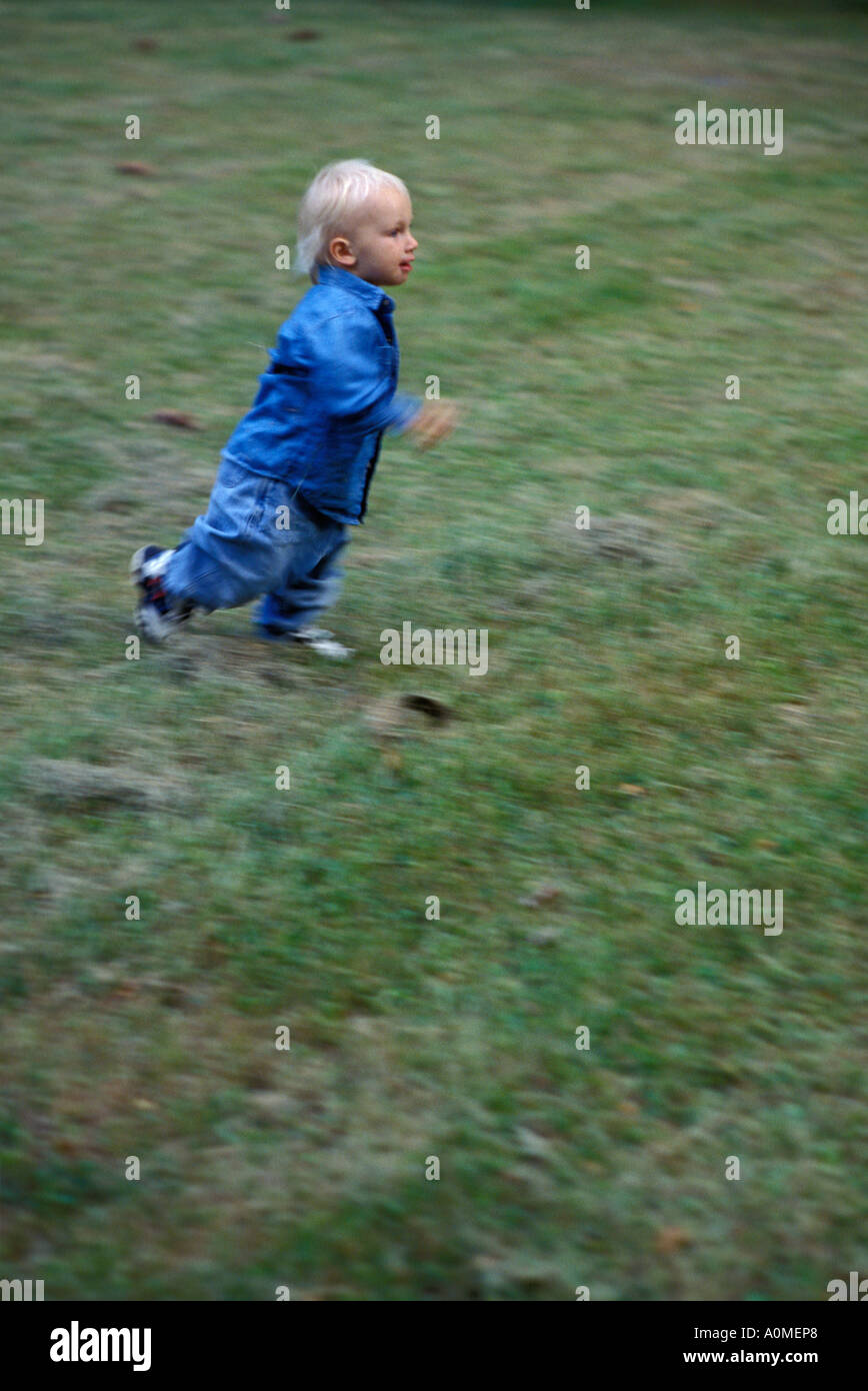 1 one young barefoot boy green grass happy frolic frolicing concept ...