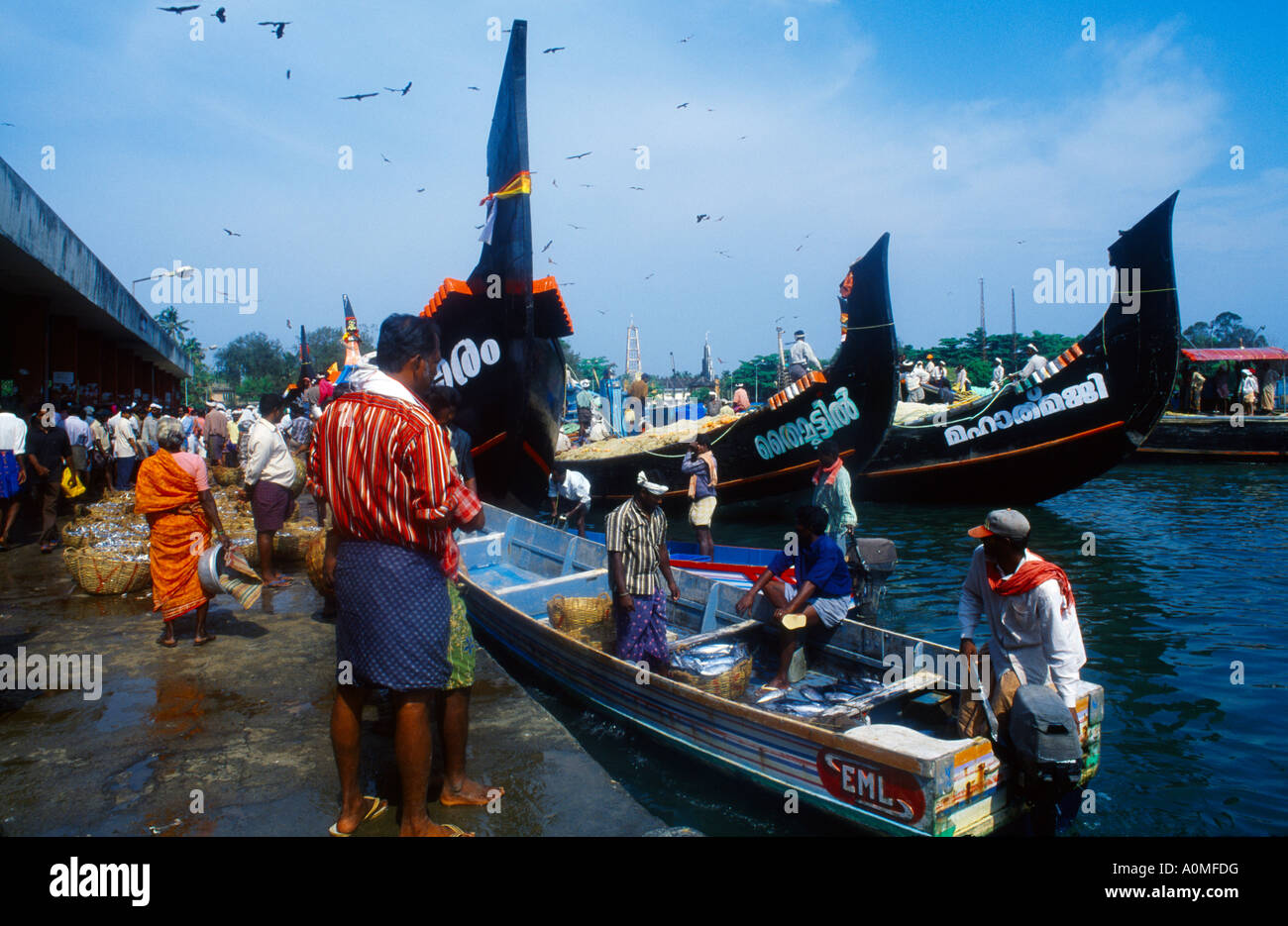 Kollam (Quilon) Kerala India Fishing Harbour with Men on Boat Stock ...
