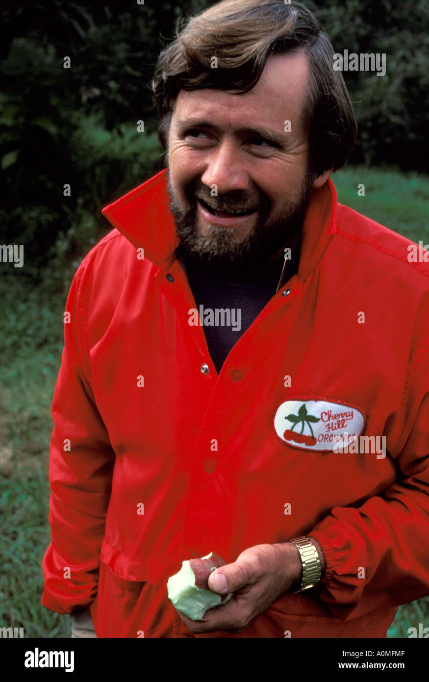 1 one man red jacket apple orchard eating beard moustache Stock Photo ...