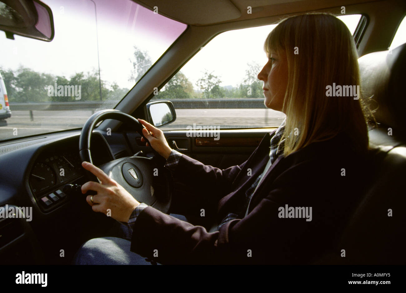 Woman driving car uk safe hi-res stock photography and images - Alamy
