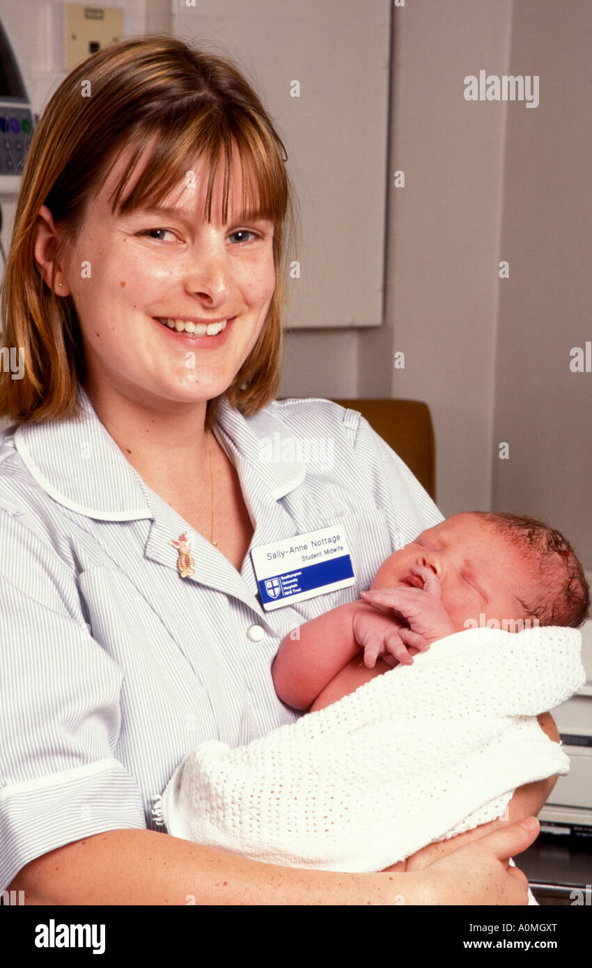 portrait happy student midwife holding newborn baby she's just ...