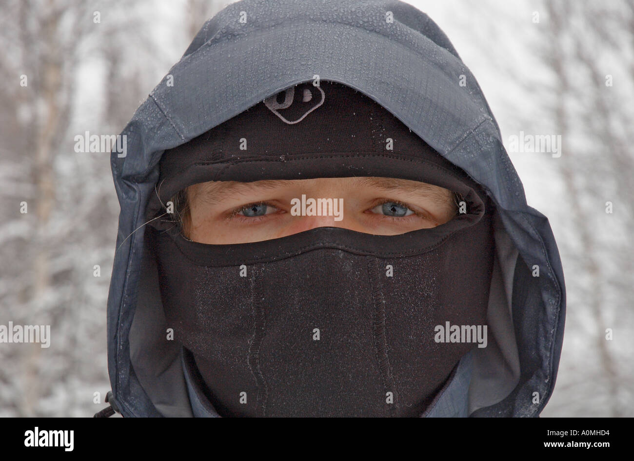 close up of a covered man with blue eyes Stock Photo - Alamy