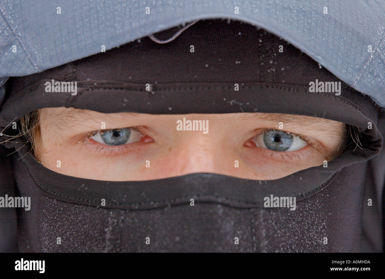 close up of a covered man with blue eyes Stock Photo - Alamy