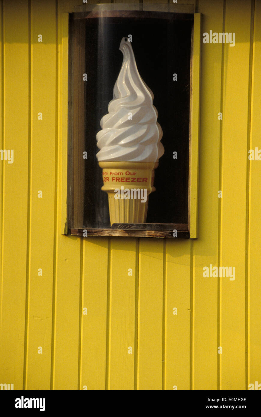 frozen ice cream custard window display yellow siding wall copy space ...