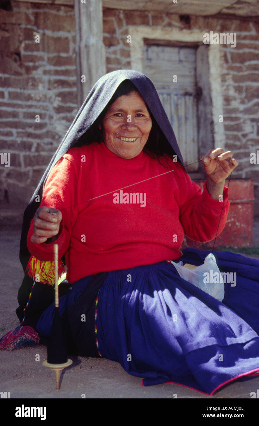 Woman spinning thread on Taquile Island on Lake Titicaca in Peru Stock ...