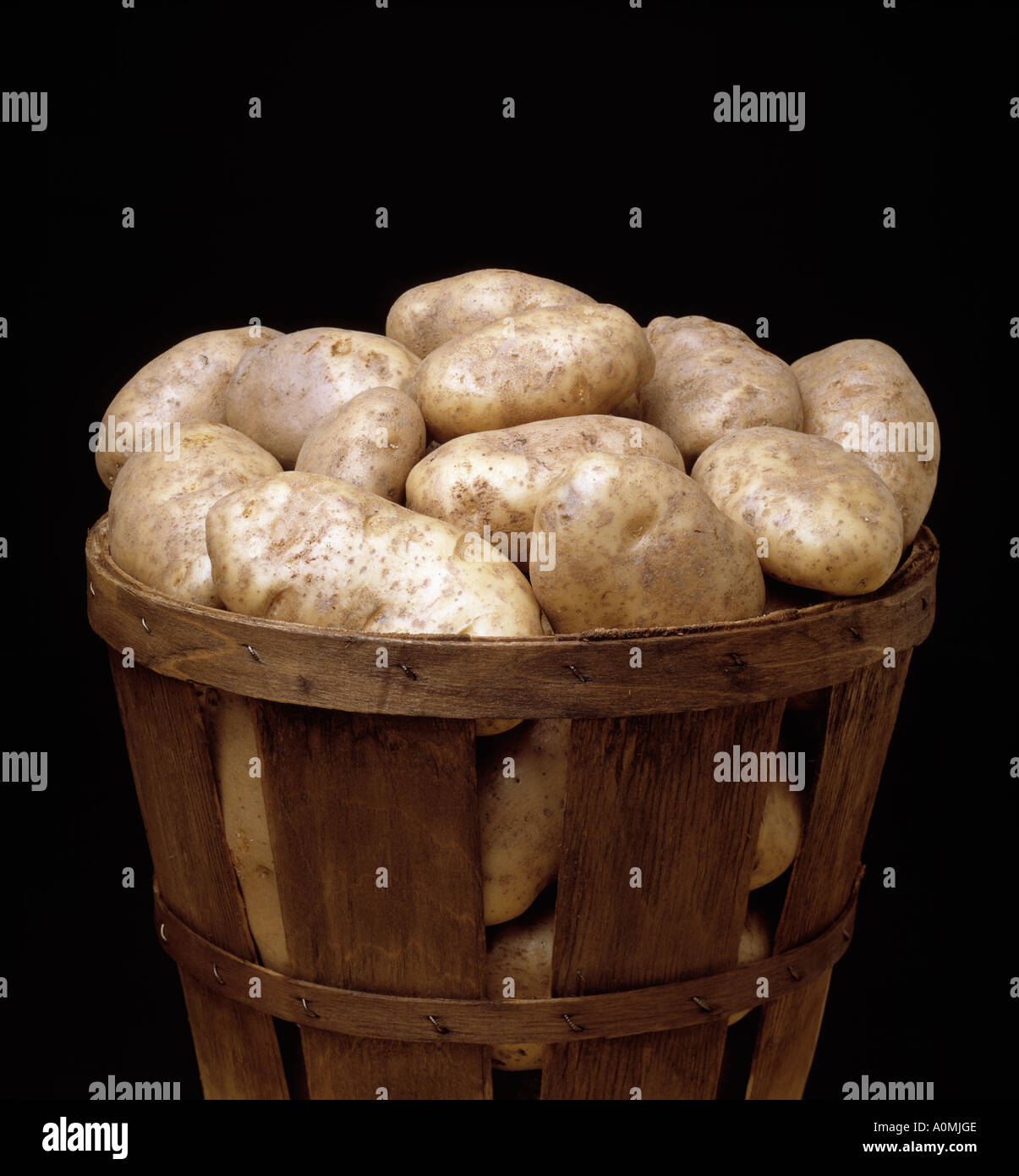 wooden basket of raw large potato potatoes vegetable farm fresh produce ...
