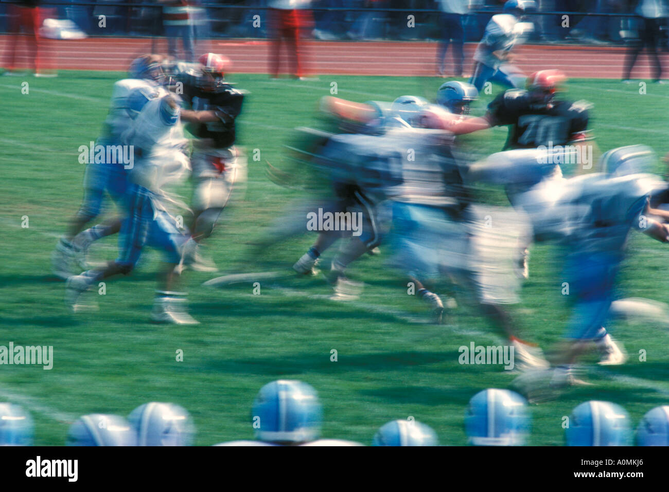 college high school football game blur Stock Photo - Alamy