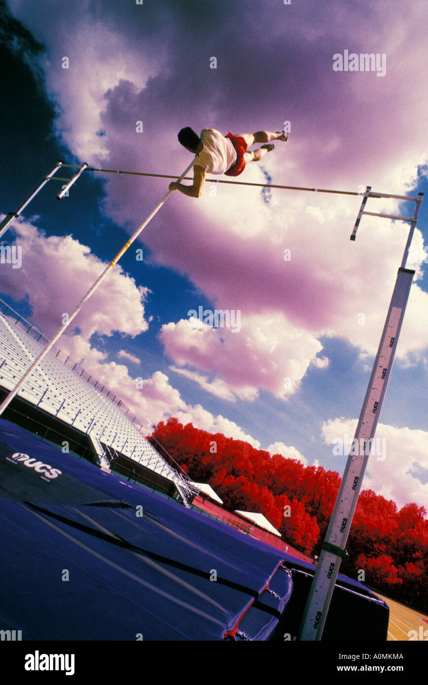 pole vaulter leaps toward sky Stock Photo - Alamy