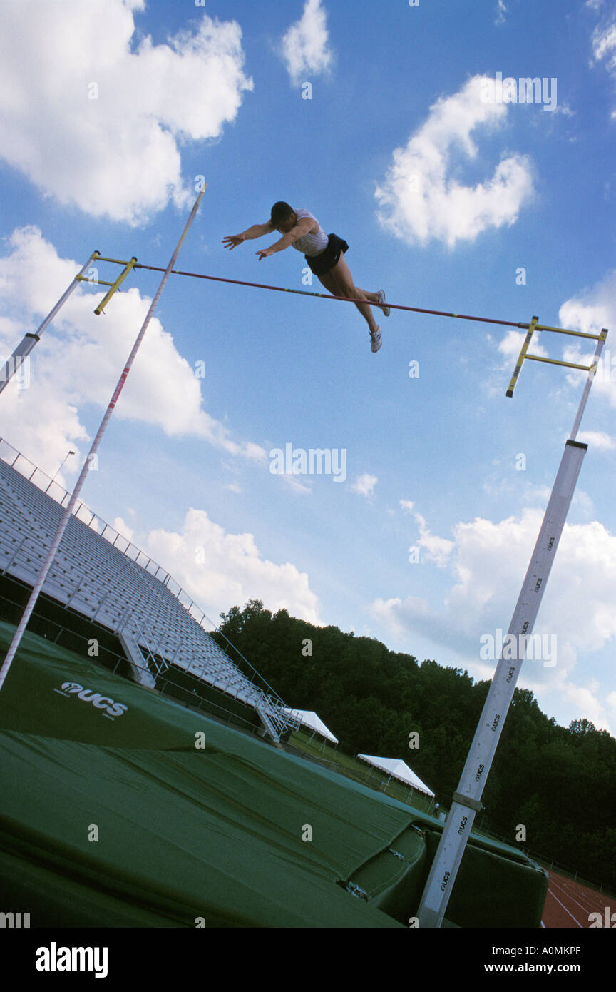 pole vaulter leaps toward sky Stock Photo - Alamy