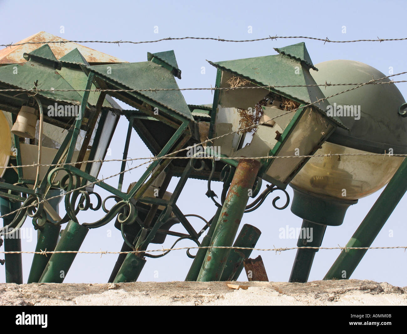 Broken street lamps in council yard Stock Photo - Alamy