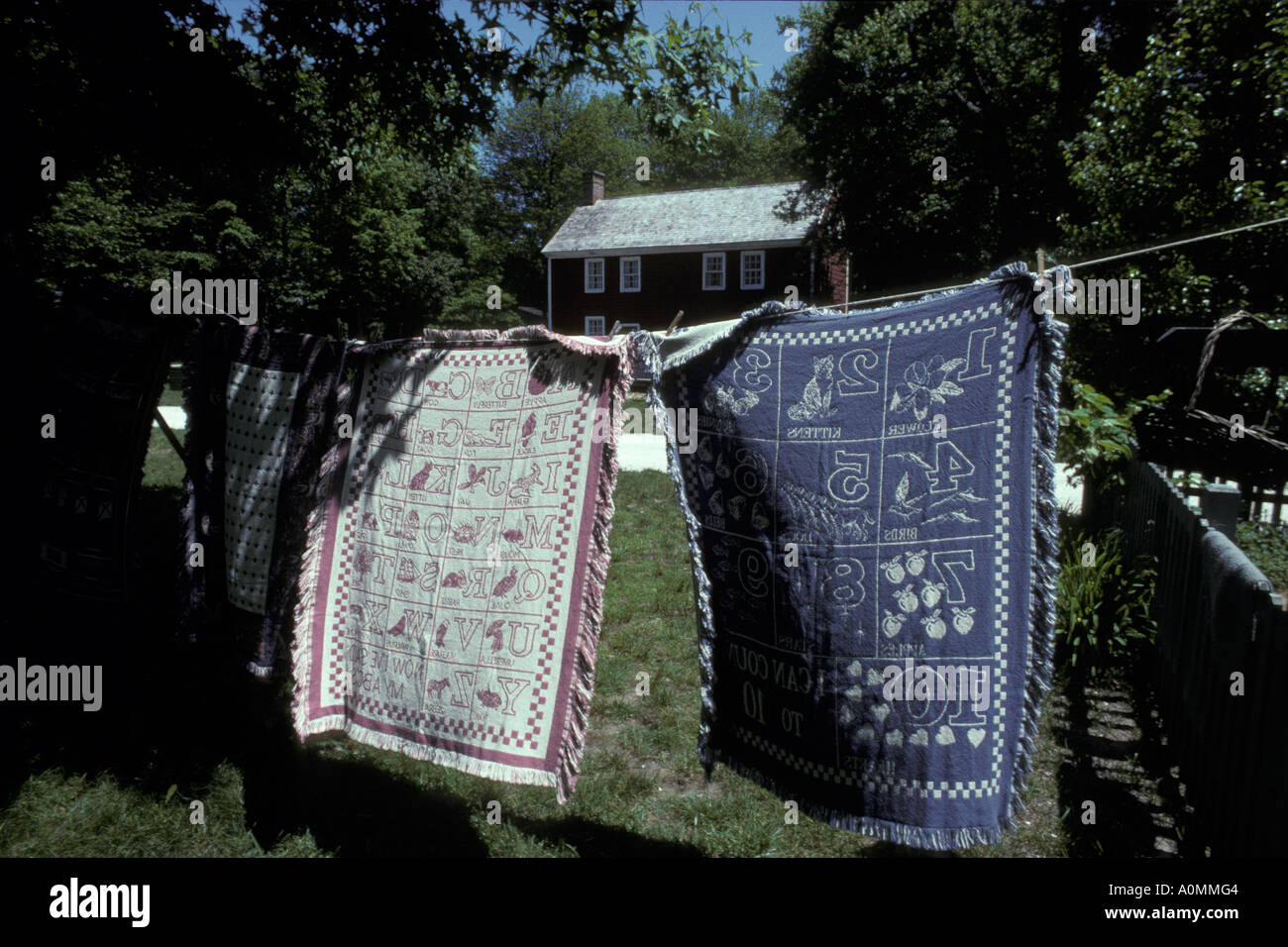 2 two quilts rugs on wash line outdoors antique craft craftsmanship ...