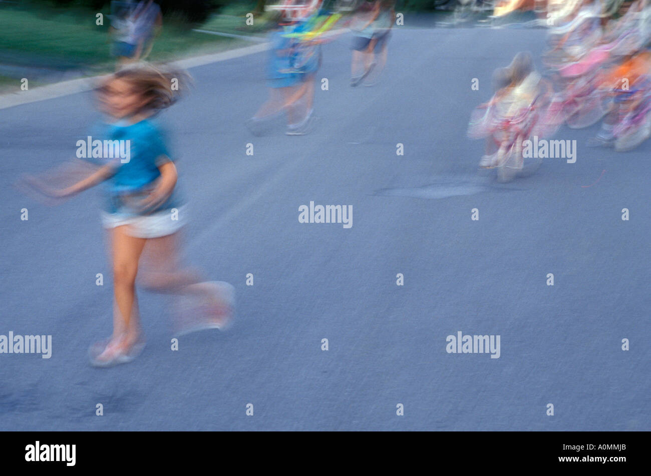 neighborhood child children blur movement motion Stock Photo - Alamy