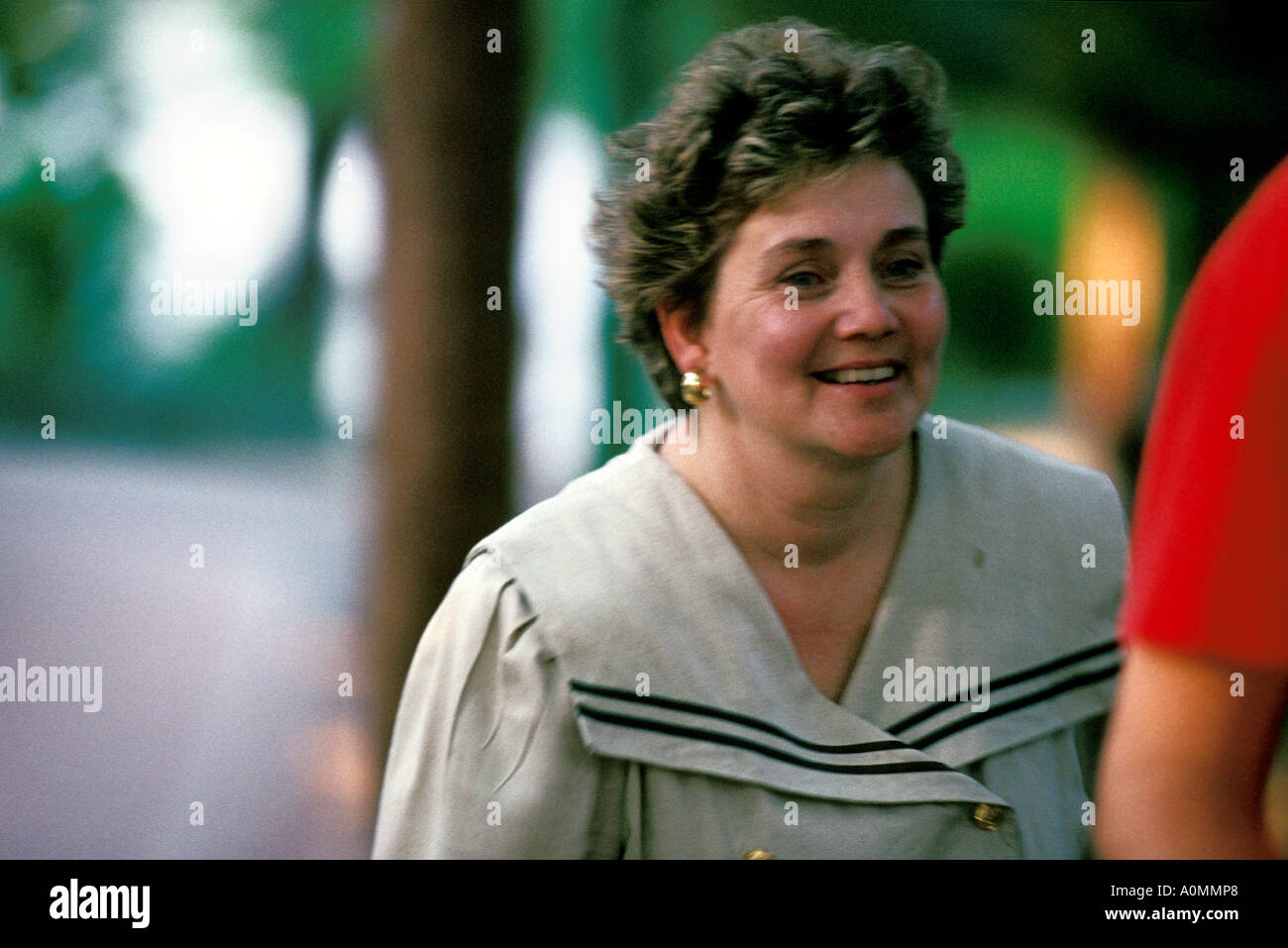 1 one smile smiling female senior citizen copy space Stock Photo - Alamy
