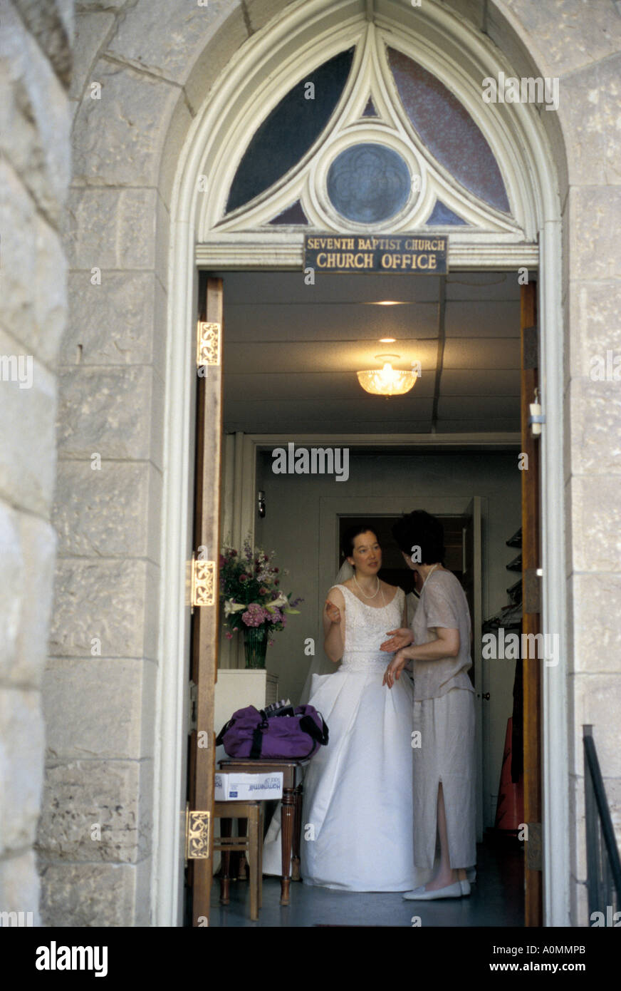 church entrance wedding party assisting bride Stock Photo - Alamy