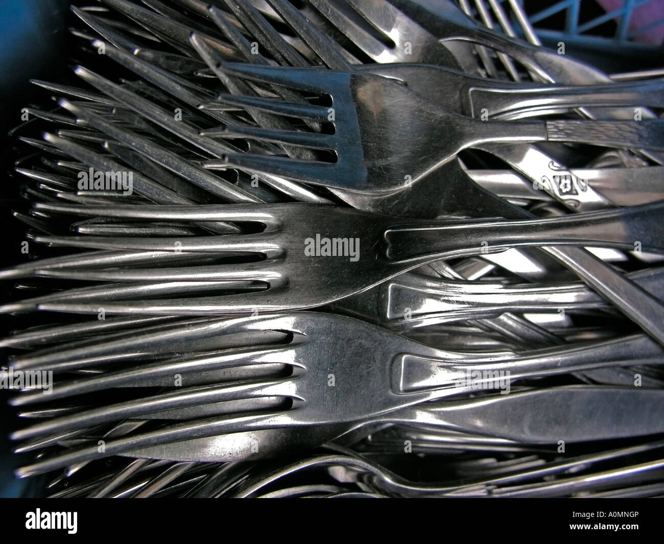 many metal stainless steel forks tableware Stock Photo - Alamy