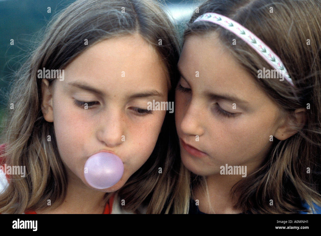 2 two smile smiling bubble gum blowing twin girl teen teenager happy ...