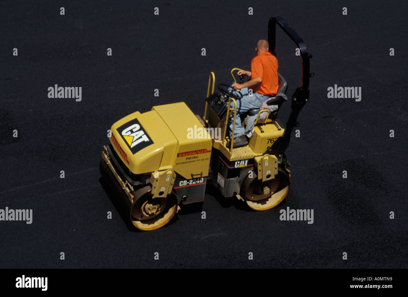 asphalt roller rolling levels smooths out street parking surface Stock ...