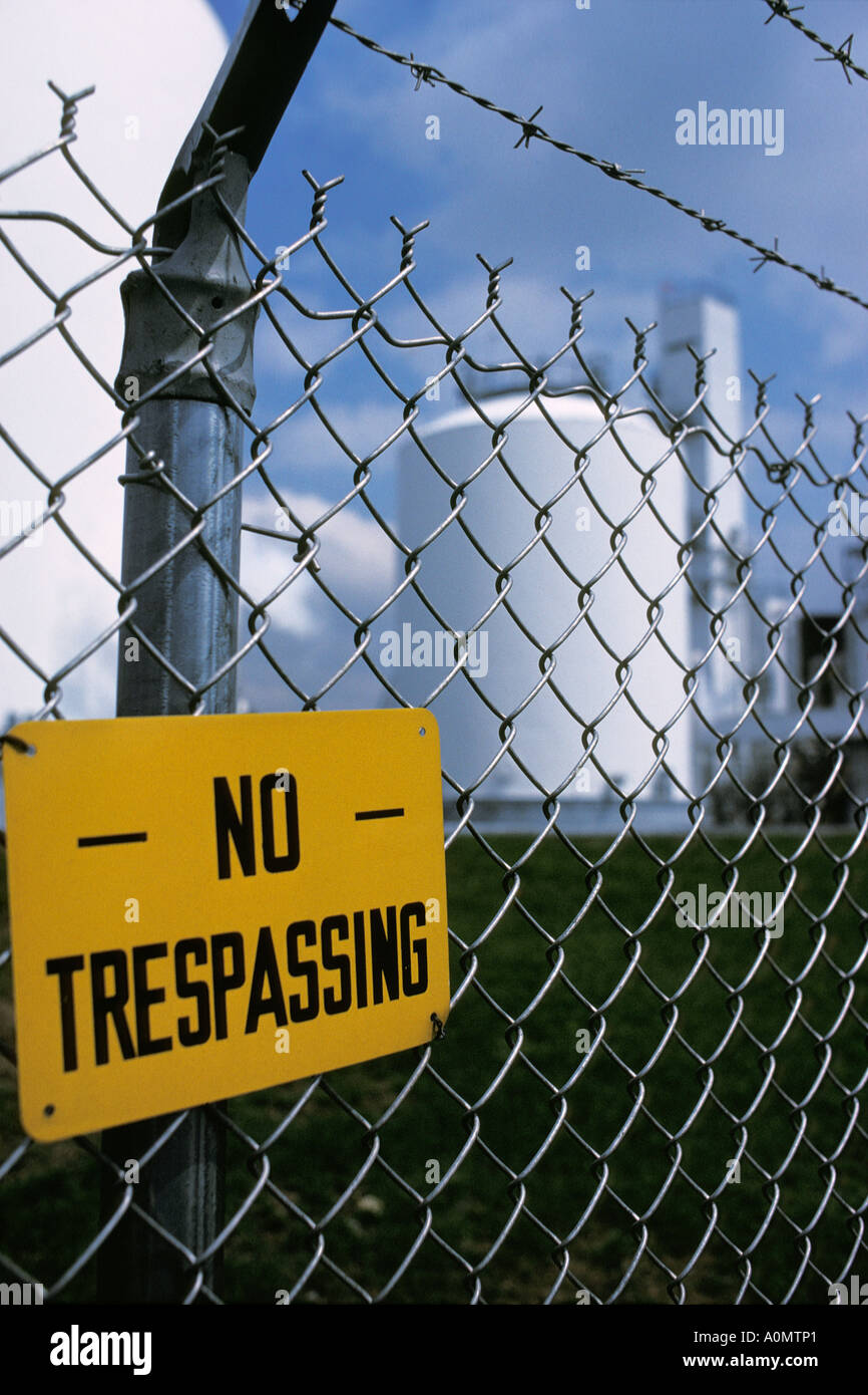 no trespassing sign chain link fence refinery oil gas petroleum ...