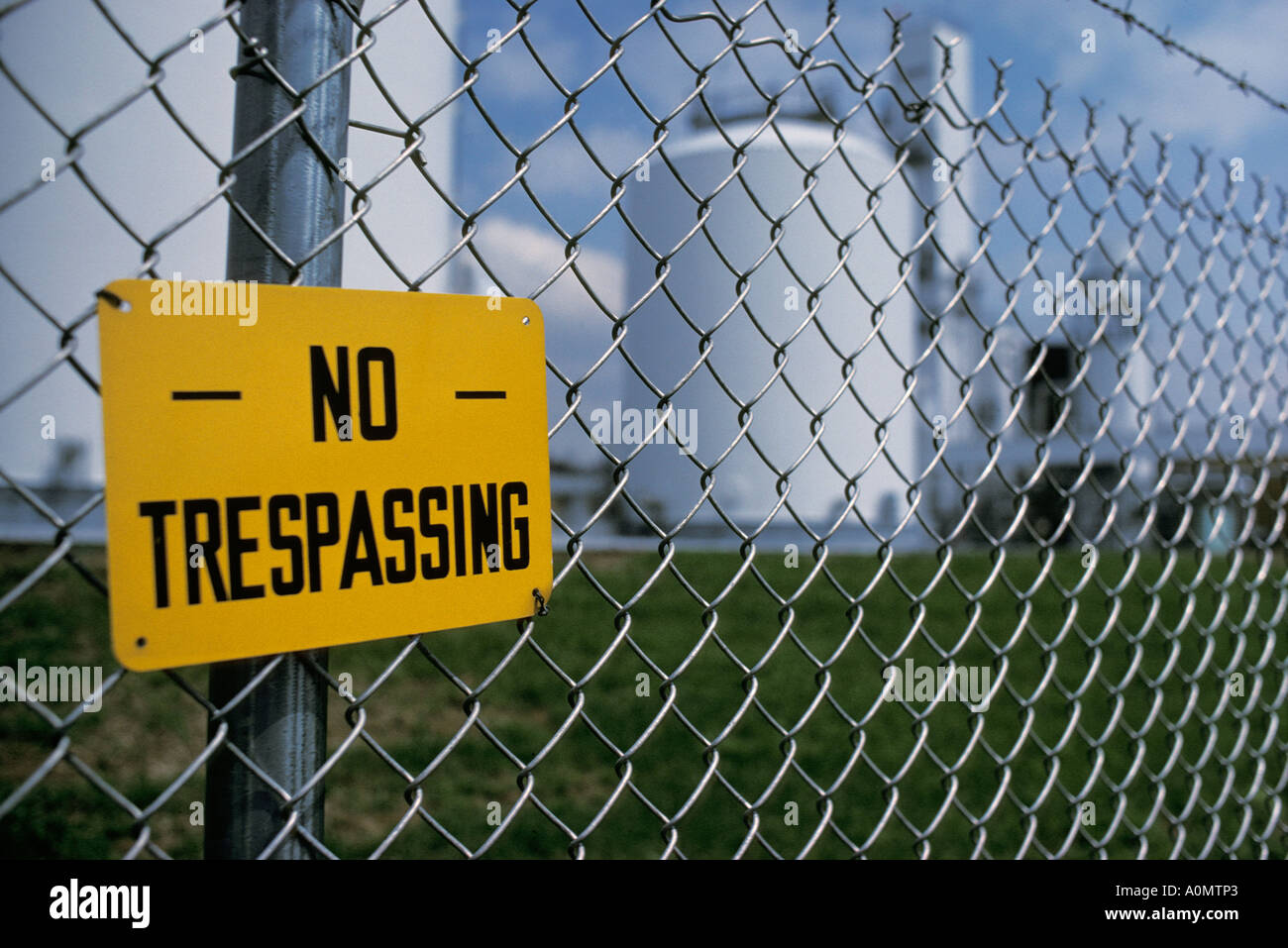 no trespassing sign chain link fence refinery oil gas petroleum ...