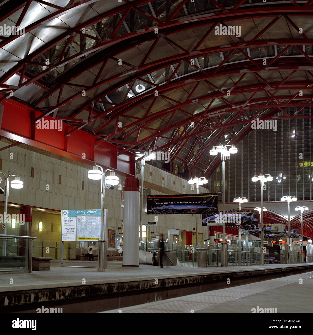 Night shot of platform at Canary Wharf Station London inc glass metal ...