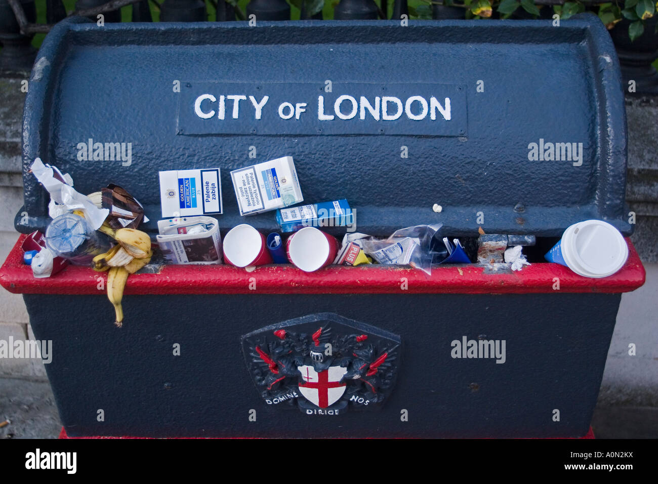 Filled waste bin, City of London, UK Stock Photo - Alamy