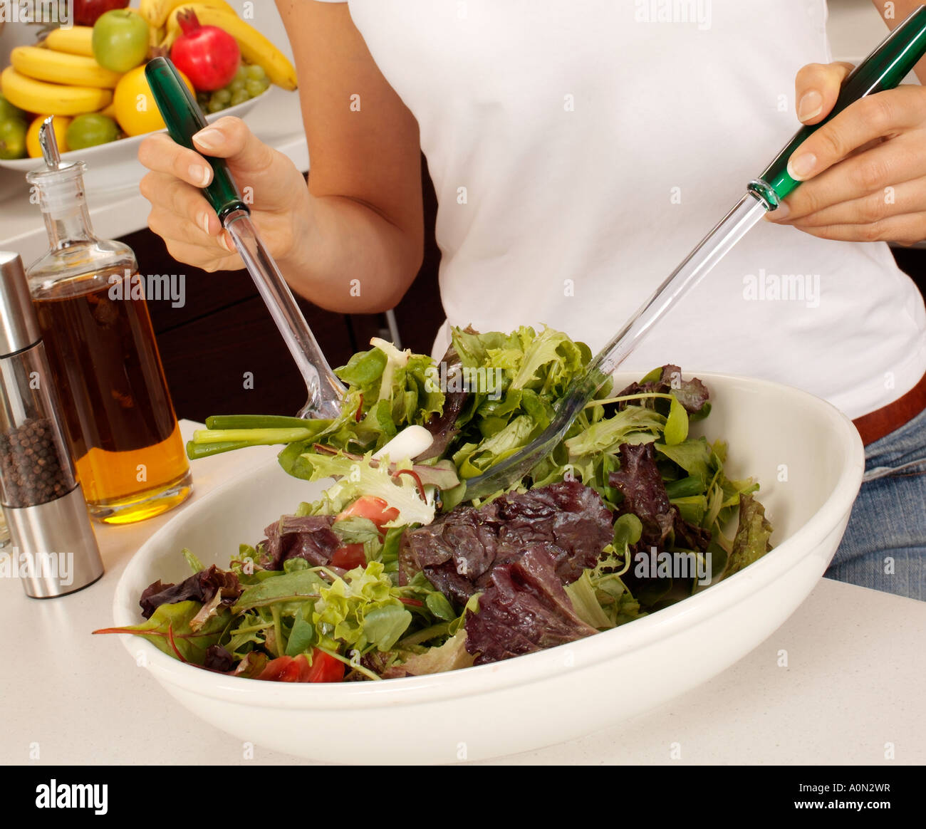 WOMAN IN KITCHEN MAKING SALAD Stock Photo - Alamy