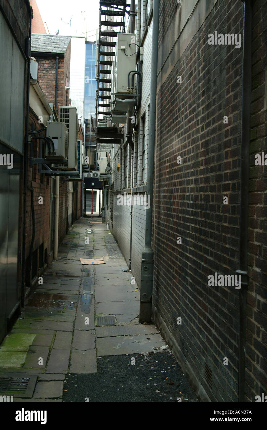 An alley behind some shops Stock Photo - Alamy