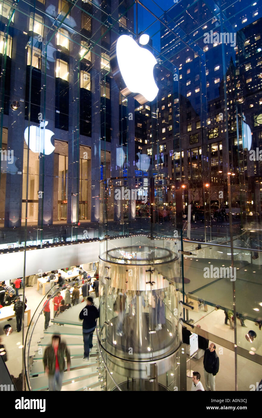 People entering Apple computers store which is below street level on ...