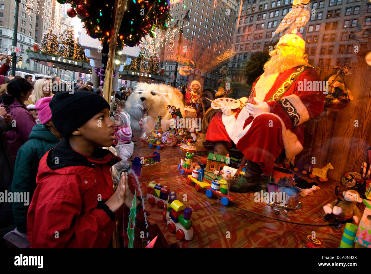Child looking at Christmas window display from Macy s department store ...