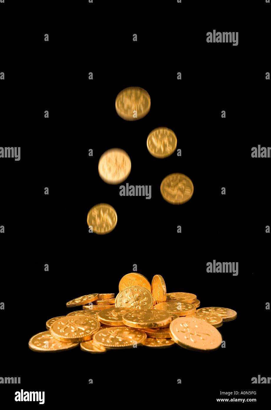 A pile of coins with others falling onto them Stock Photo - Alamy