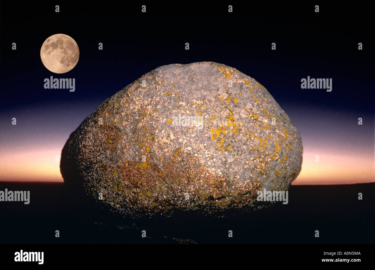 Full moon and a boulder on Cadillac Mountain in Acadia National Park at ...