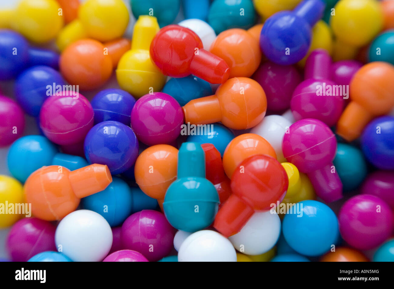Differently coloured plastic pegs Stock Photo - Alamy