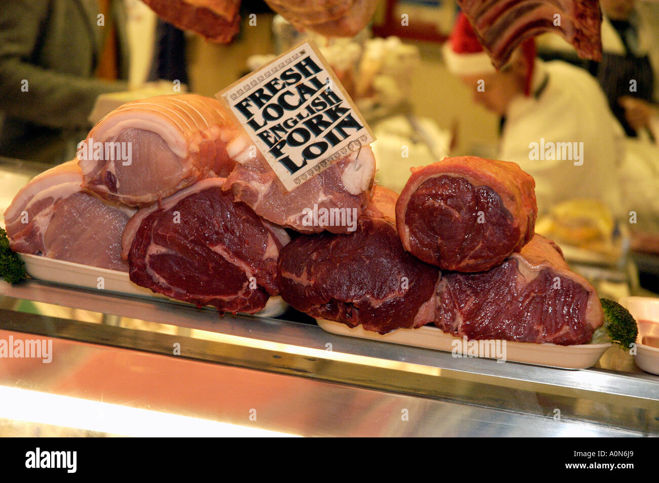 Fresh local English pork loin on display for sale at a butchers in ...