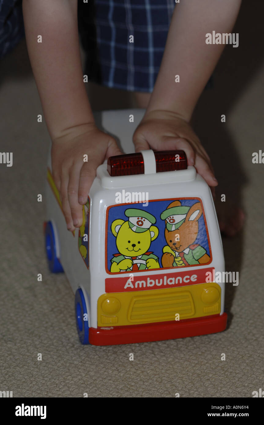 toddler playing with ambulance hands kid child boy male three caucasian ...