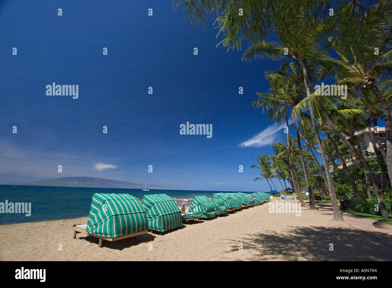 Sun cabanas on Kaanapali Beach, facing the island of Lanai, from Maui ...
