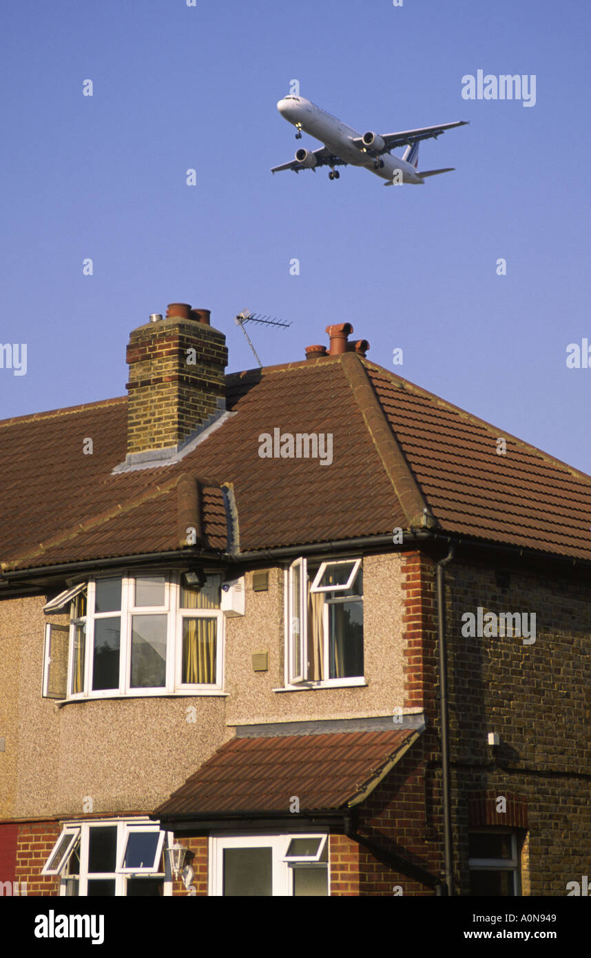 Plane Flying Over Houses Heathrow Stock Photos & Plane Flying Over ...