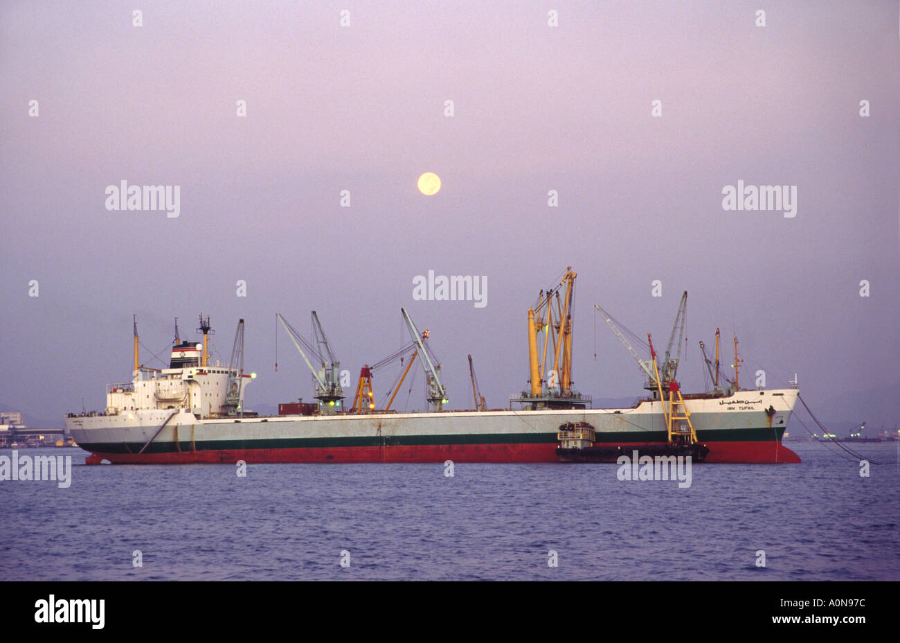 Container Ship and Full Moon at Dawn Hong Kong Harbour Stock Photo - Alamy