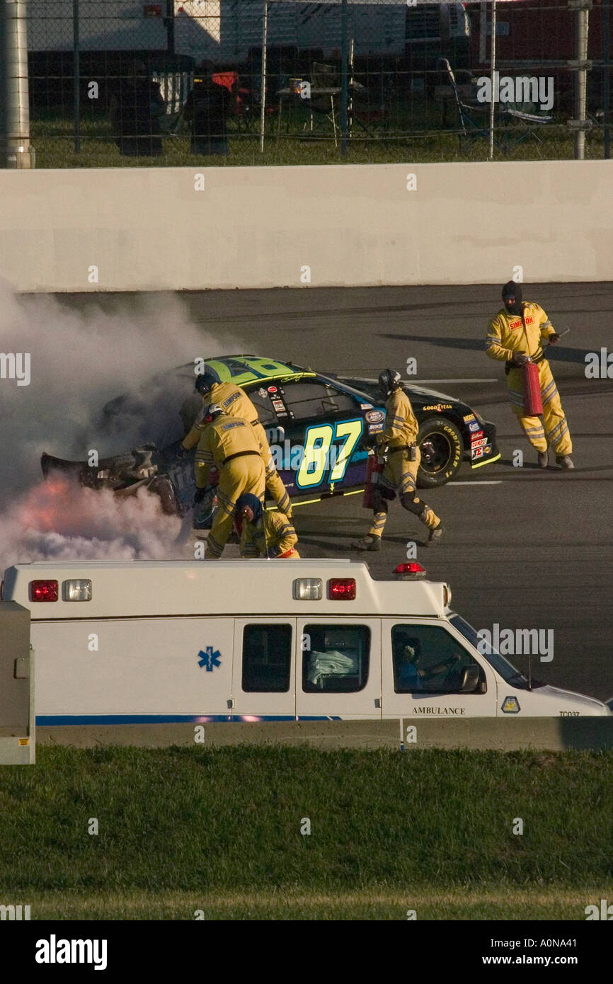 Emergency response firefighters and medical personnel fight fire in ...
