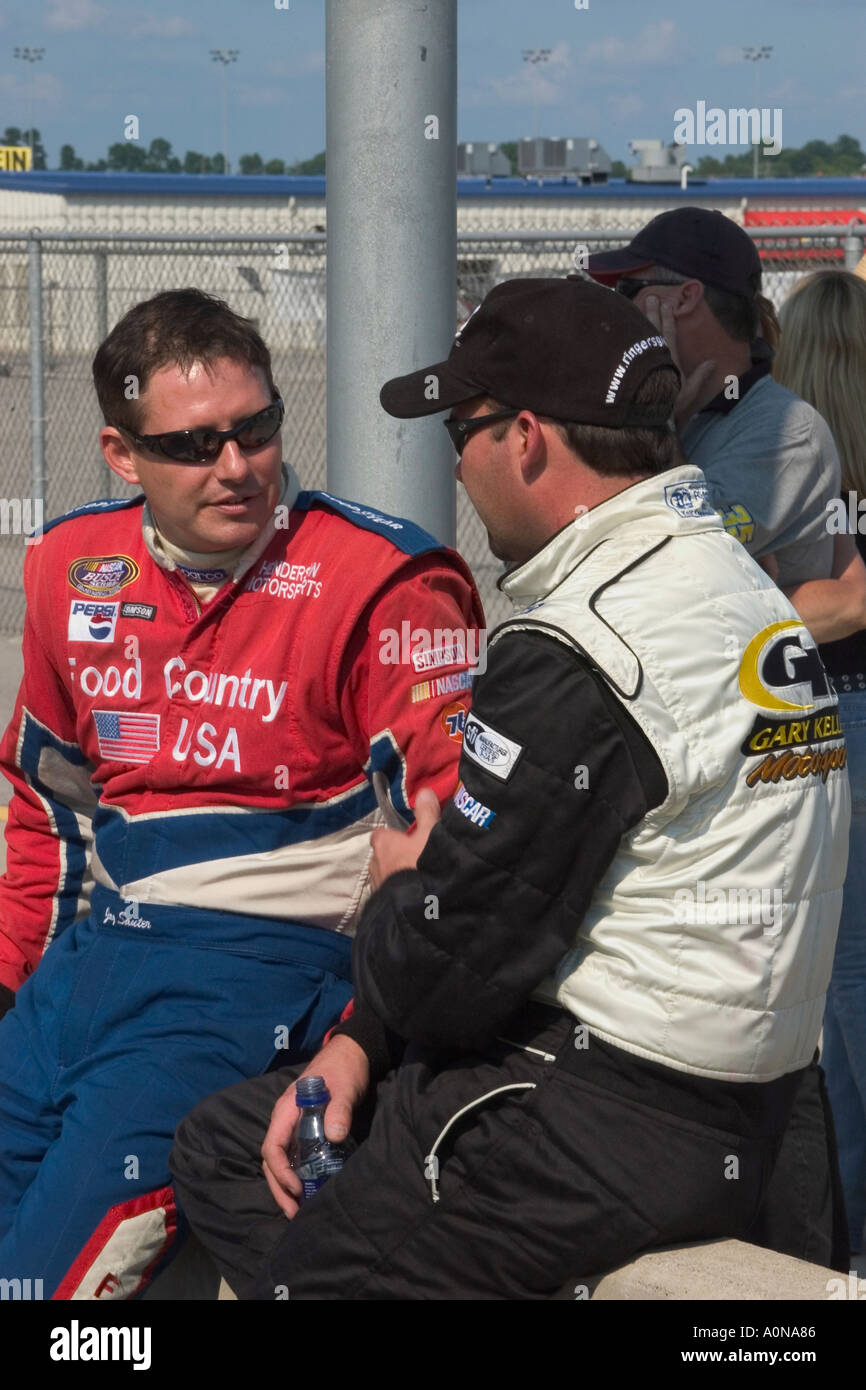 NASCAR drivers Jay Sauter and Kenny Hendrick talking in the pit area of ...