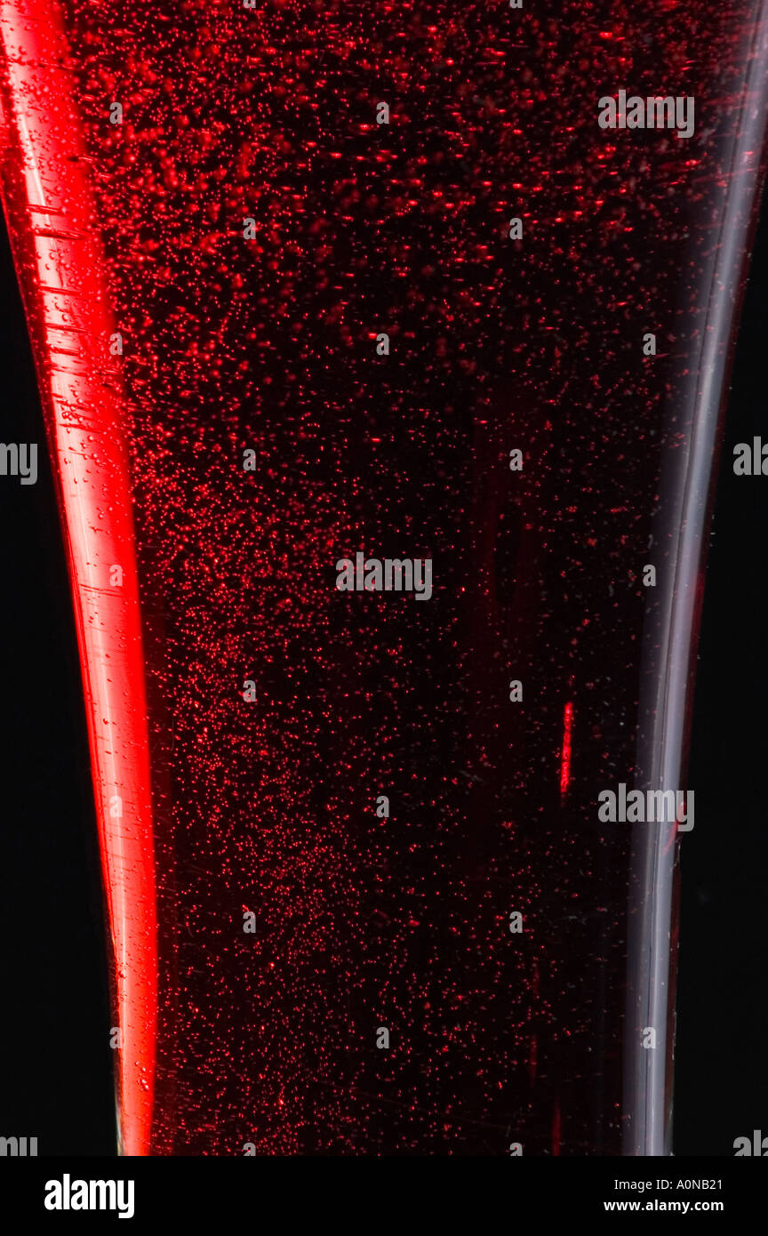 Red liquid in glass with rising bubbles Stock Photo - Alamy