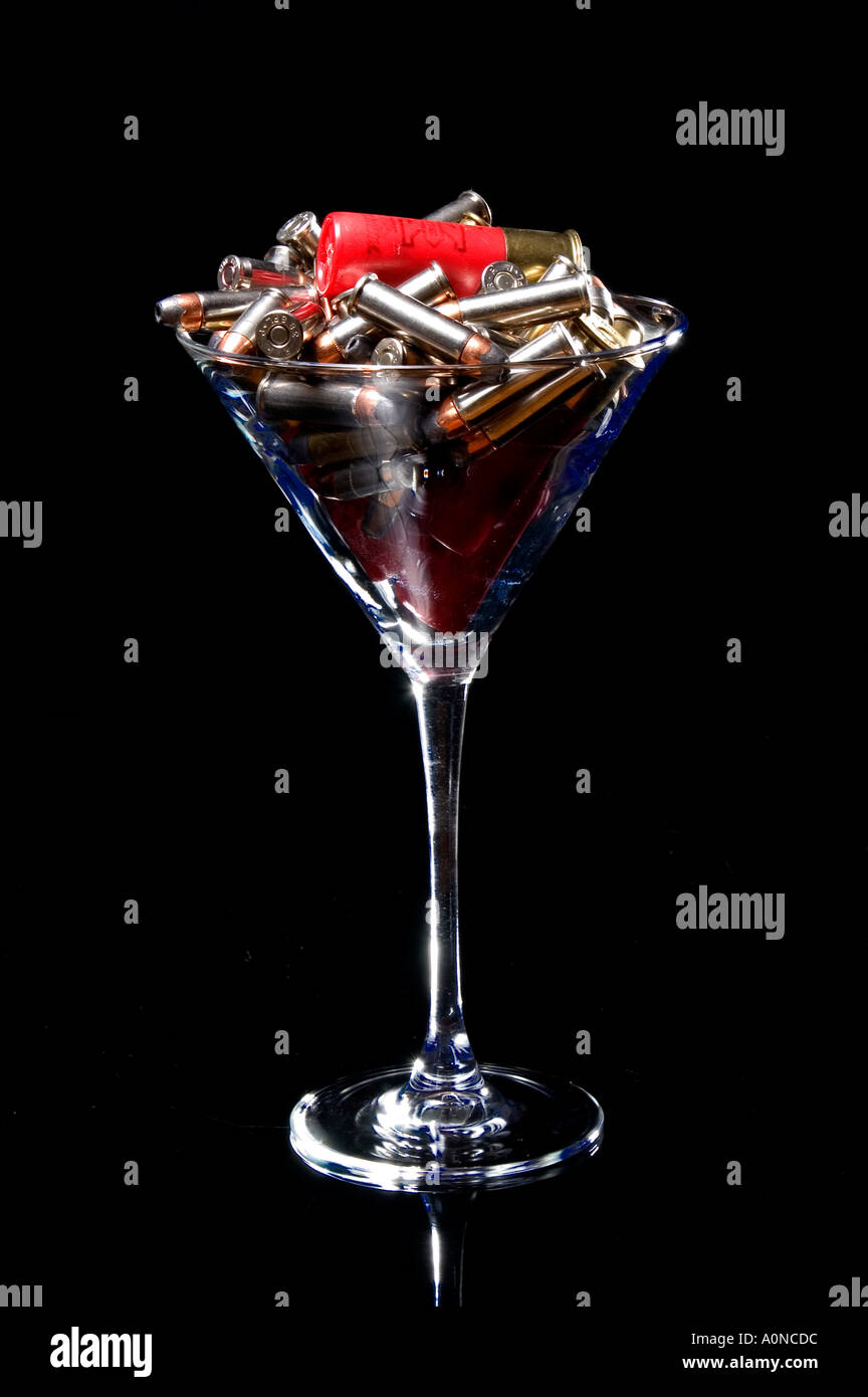 Martini glass filled with firearms ammunition Stock Photo - Alamy