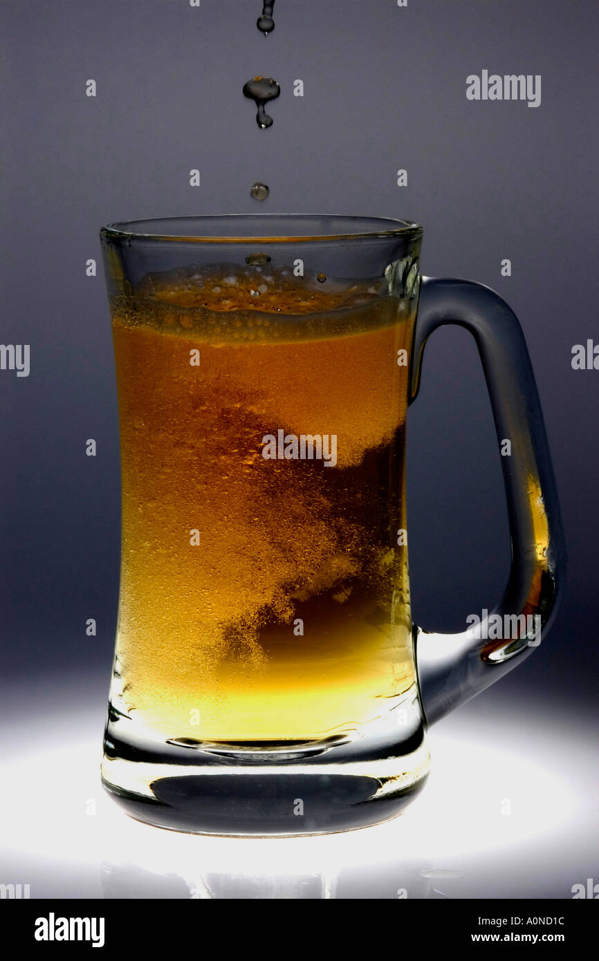 Motion shot of large beer mug being filled Stock Photo - Alamy